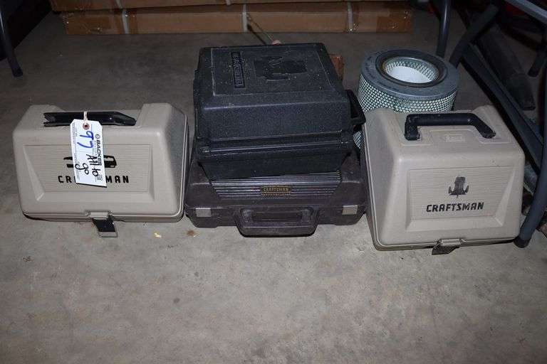 All to go - Assorted empty tool cases under table - Backes Commercial Auctioneers