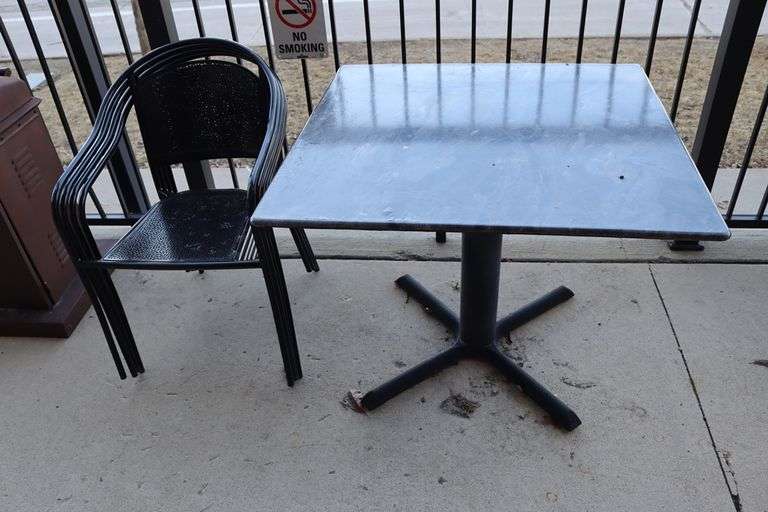 36" x 36" Laminate top patio table with (4) black metal stack chairs ...