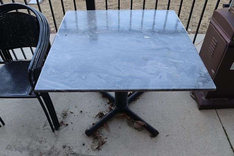 36" x 36" Laminate top patio table with (4) black metal stack chairs ...