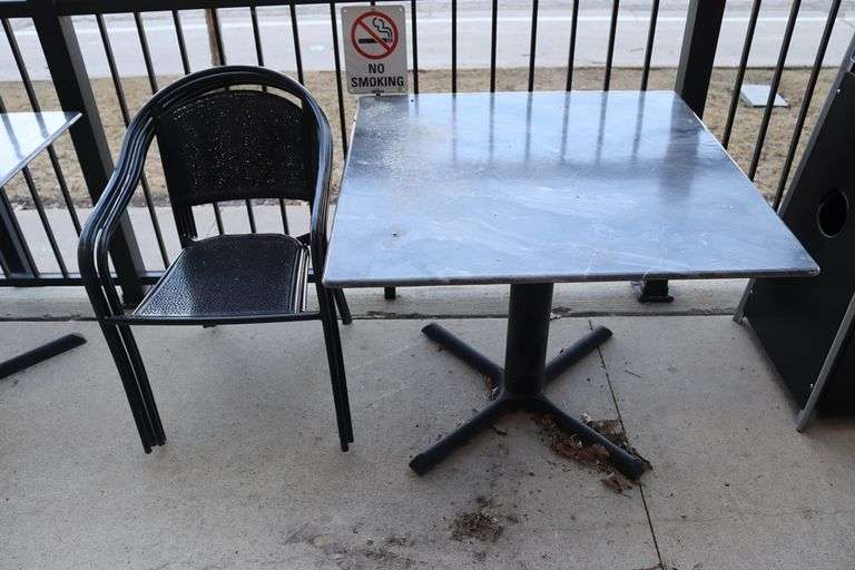 36" x 36" Laminate top patio table with (4) black metal stack chairs ...