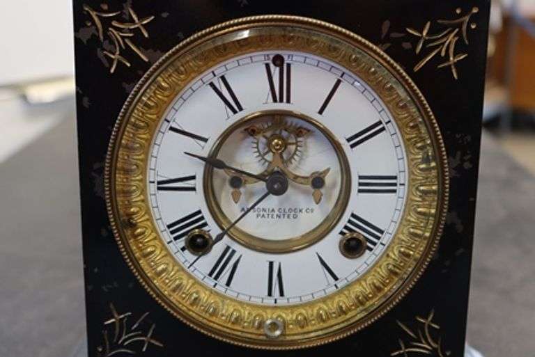 9" x 11" Cast iron Ansonia mantle clock - Backes Commercial Auctioneers