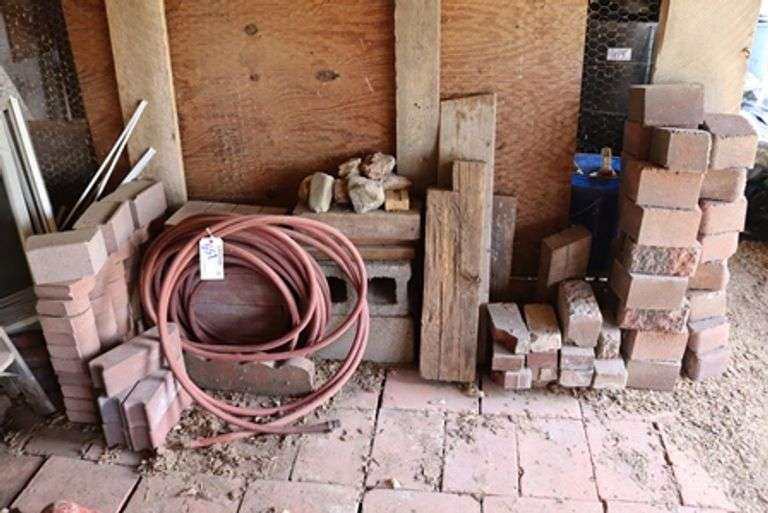 Wall to go - assorted brick, cinder blocks & garden hose - Backes ...