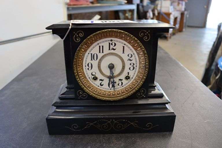 10" x 11" Cast iron Ansonia mantle clock - Backes Commercial Auctioneers
