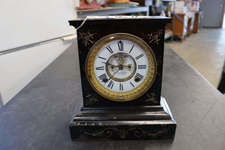 9" x 11" Cast iron Ansonia mantle clock - Backes Commercial Auctioneers