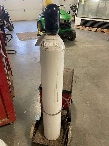Argon tank with cap - tank is 42" tall - Backes Commercial Auctioneers