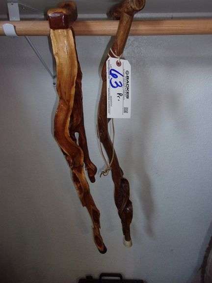 Pair of ornate walking sticks - Backes Commercial Auctioneers