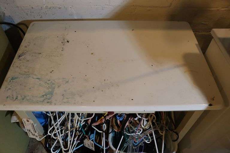 24" x 40" wood framed laminate top table - located in basement - Backes ...