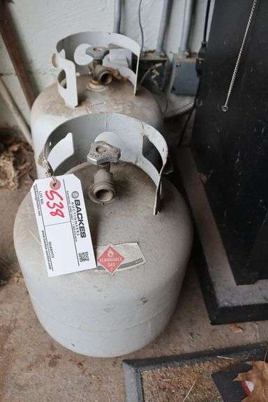 Pair to go - 20 lb. LP tanks - 1 is full - Backes Commercial Auctioneers
