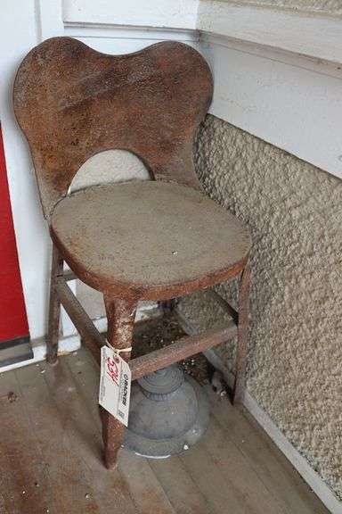 Rusted metal chair - Backes Commercial Auctioneers