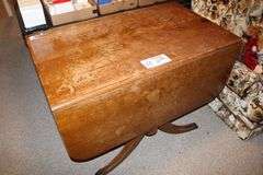 42" x 56" Maple drop leaf table, 3 legs - Backes Commercial Auctioneers