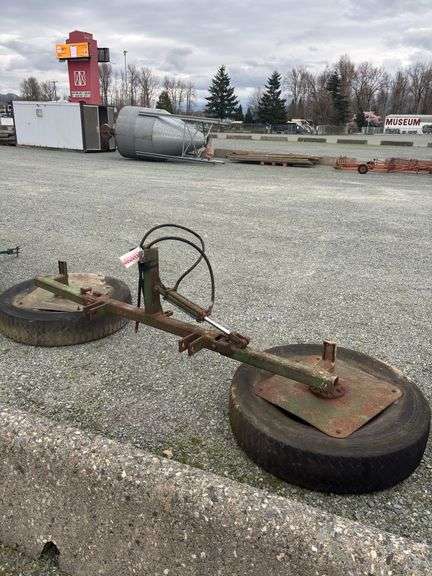 Tire Feed Pusher - Beekman Auctions Ltd