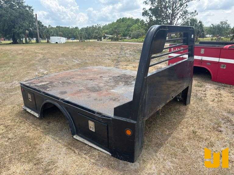 CM FLATBED 9’ UTILITY BODY - Jeff Martin Auctioneers, Inc.