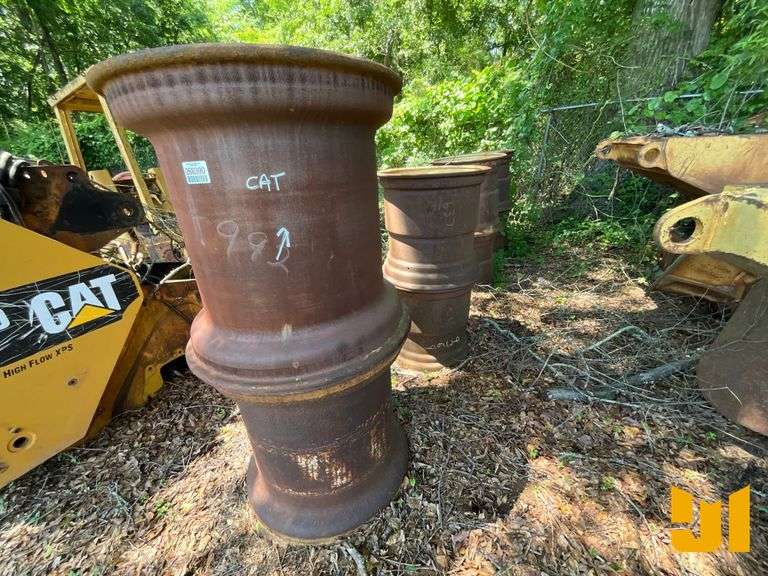 LOT OF 8 CAT RIMS - Jeff Martin Auctioneers, Inc.