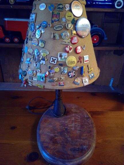Old Lamp with lots of collectable pins and buttons on the lampshade ...